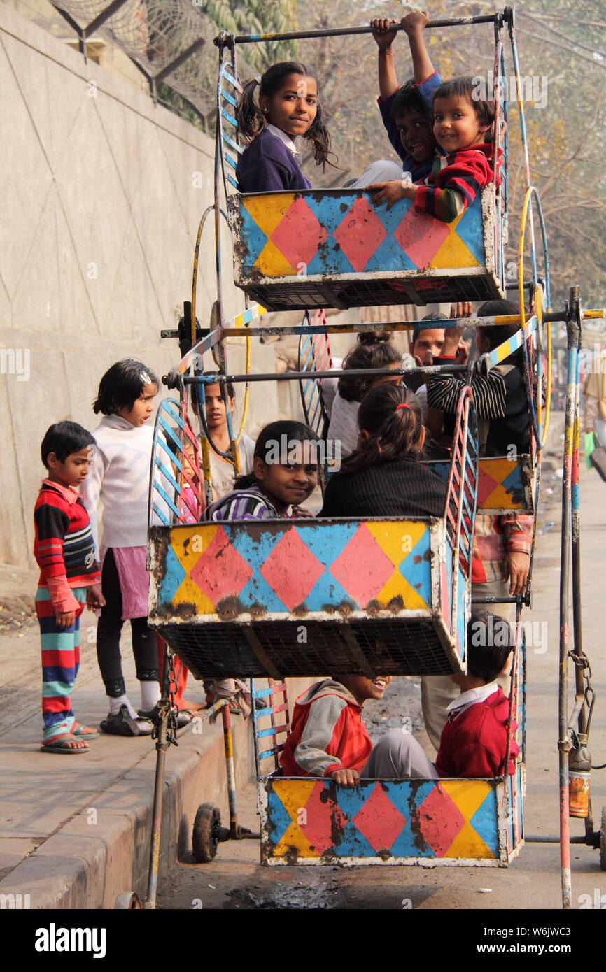 Children playing on an amusement park ride Stock Photo - Alamy