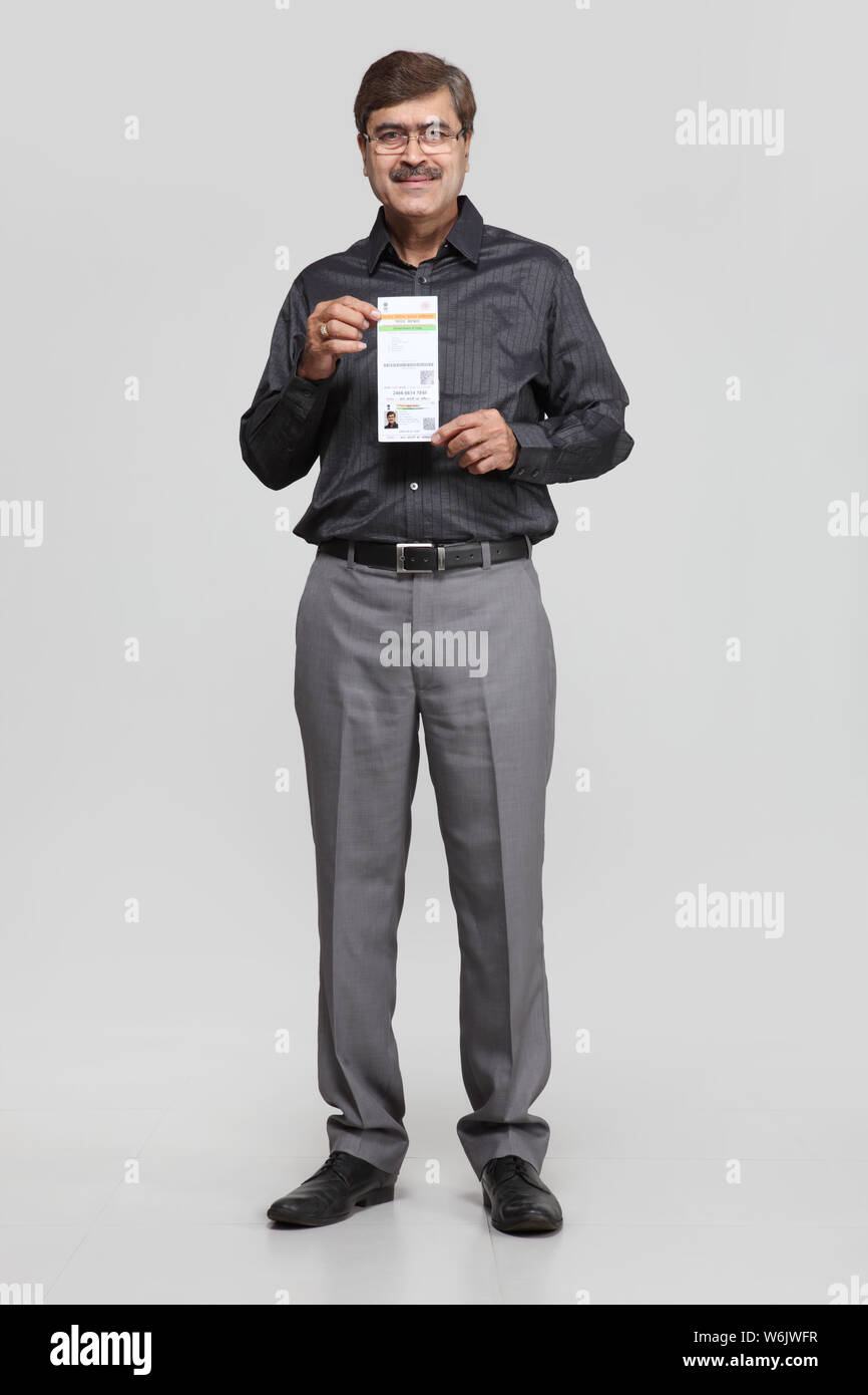 Man showing an Aadhar card Stock Photo - Alamy