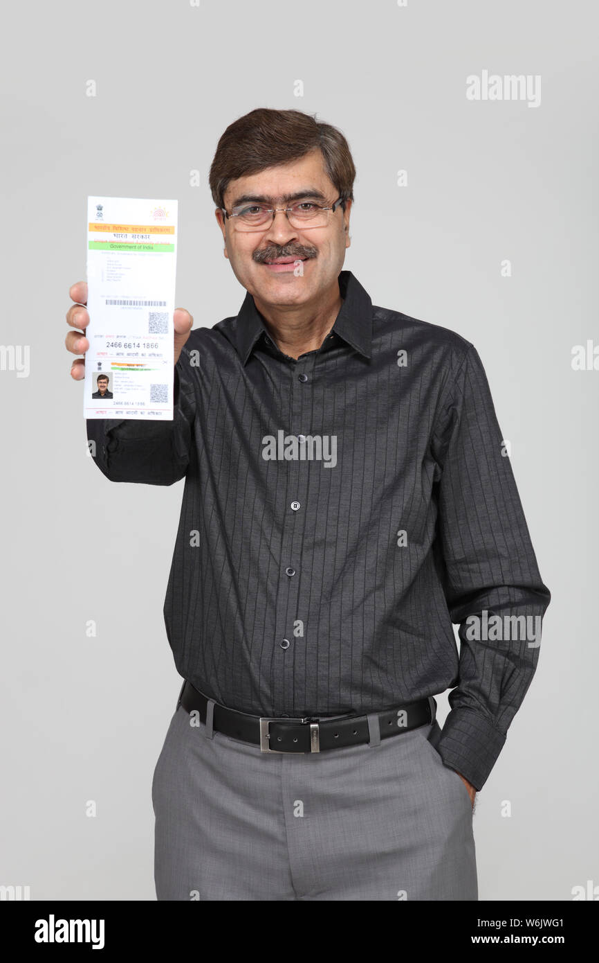 Man showing an Aadhar card Stock Photo - Alamy