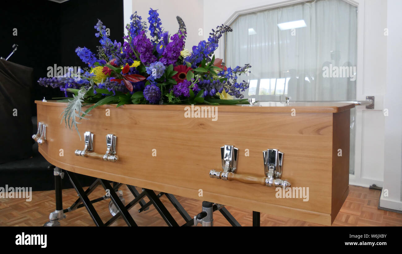 closeup shot of a funeral casket in a hearse or chapel or burial at ...