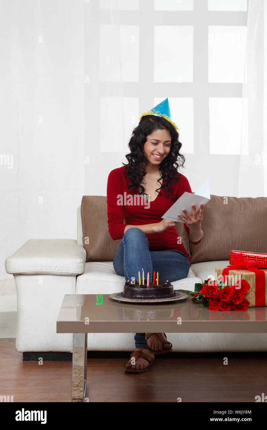 Woman reading birthday card Stock Photo - Alamy