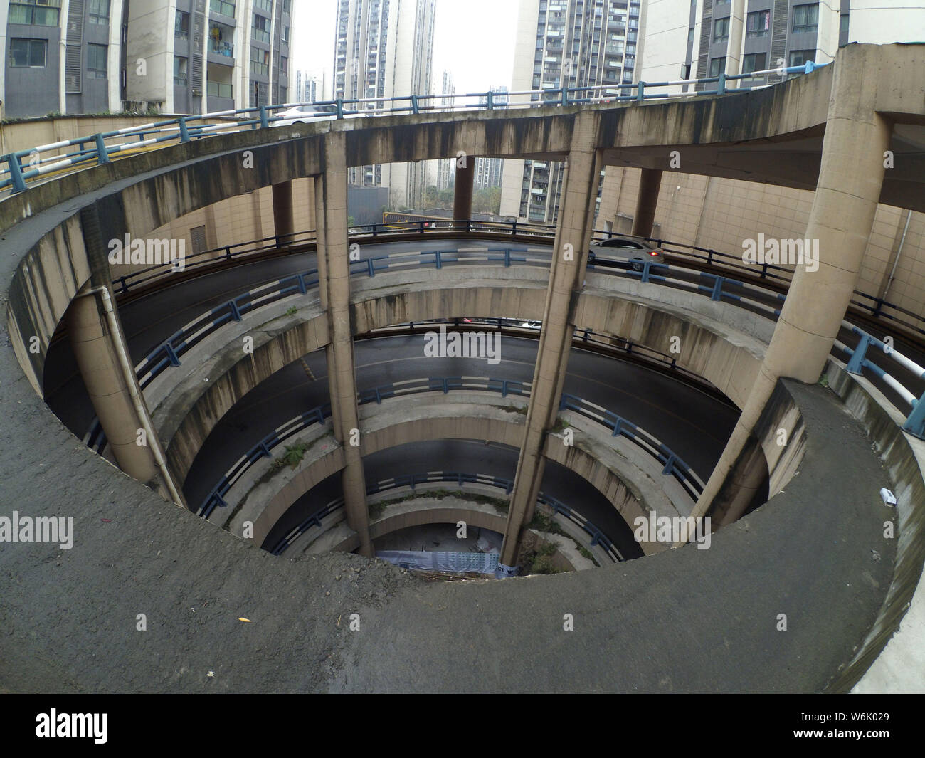 Aerial view of the 5-story high spiral parking lot at a residential ...