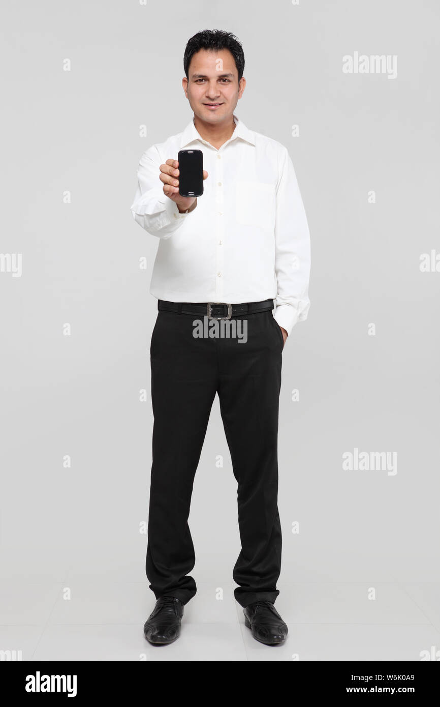 Salesman showing a smart phone Stock Photo - Alamy