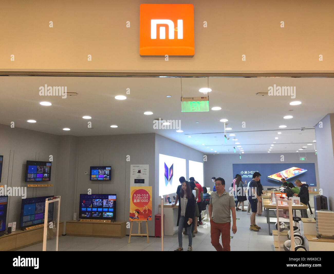 --FILE--Customers are pictured at a Xiaomi store in Shanghai, China, 3 ...