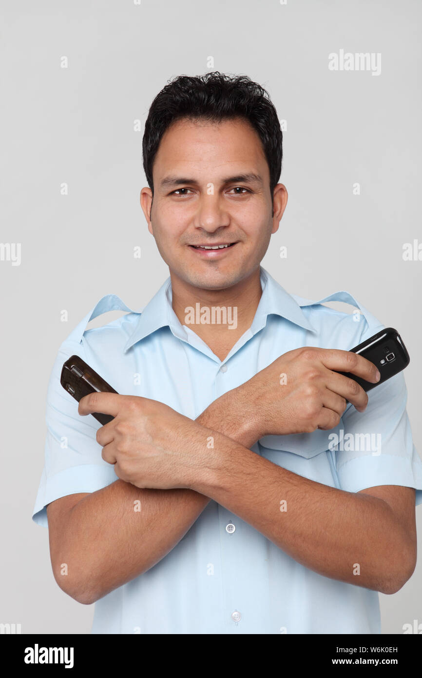 Young man giving mobile phone hi-res stock photography and images - Alamy