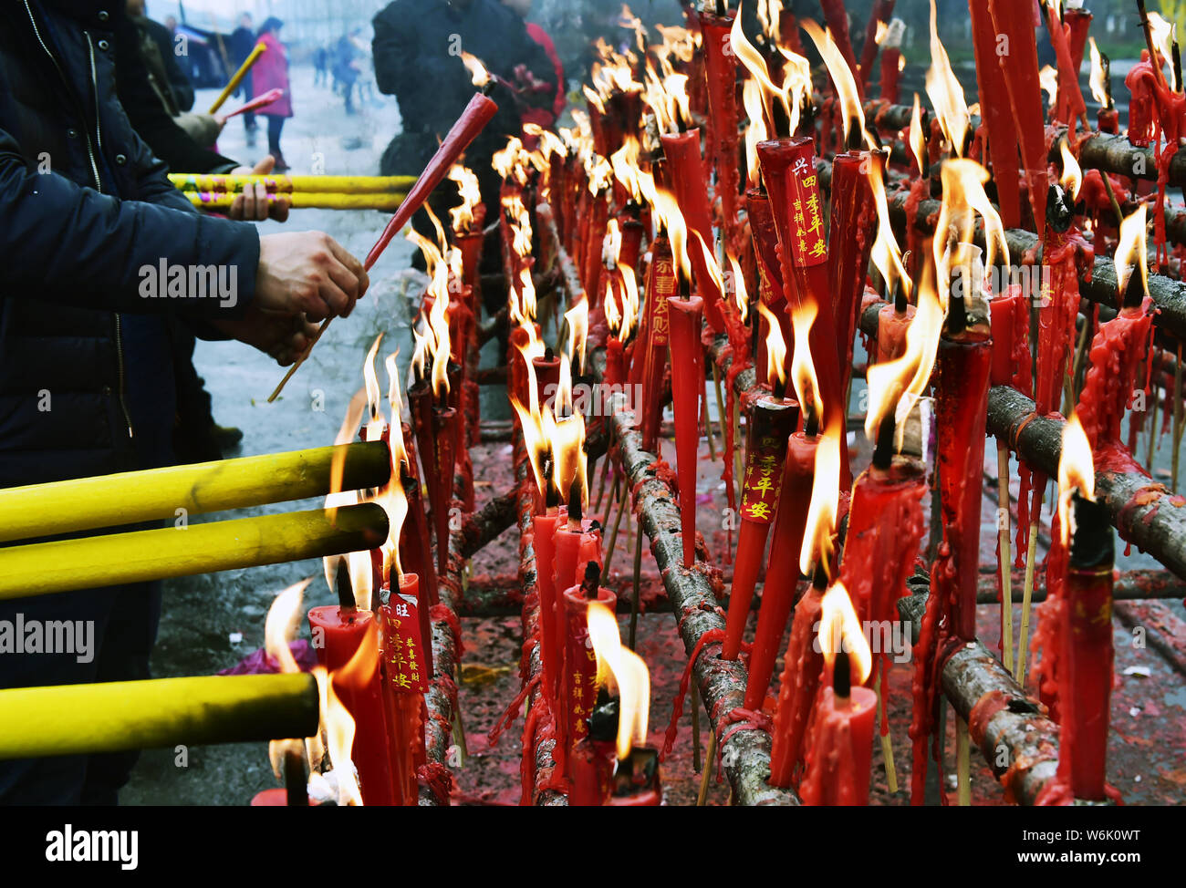Chinese worshippers burn joss sticks (incenses) to pray for good ...