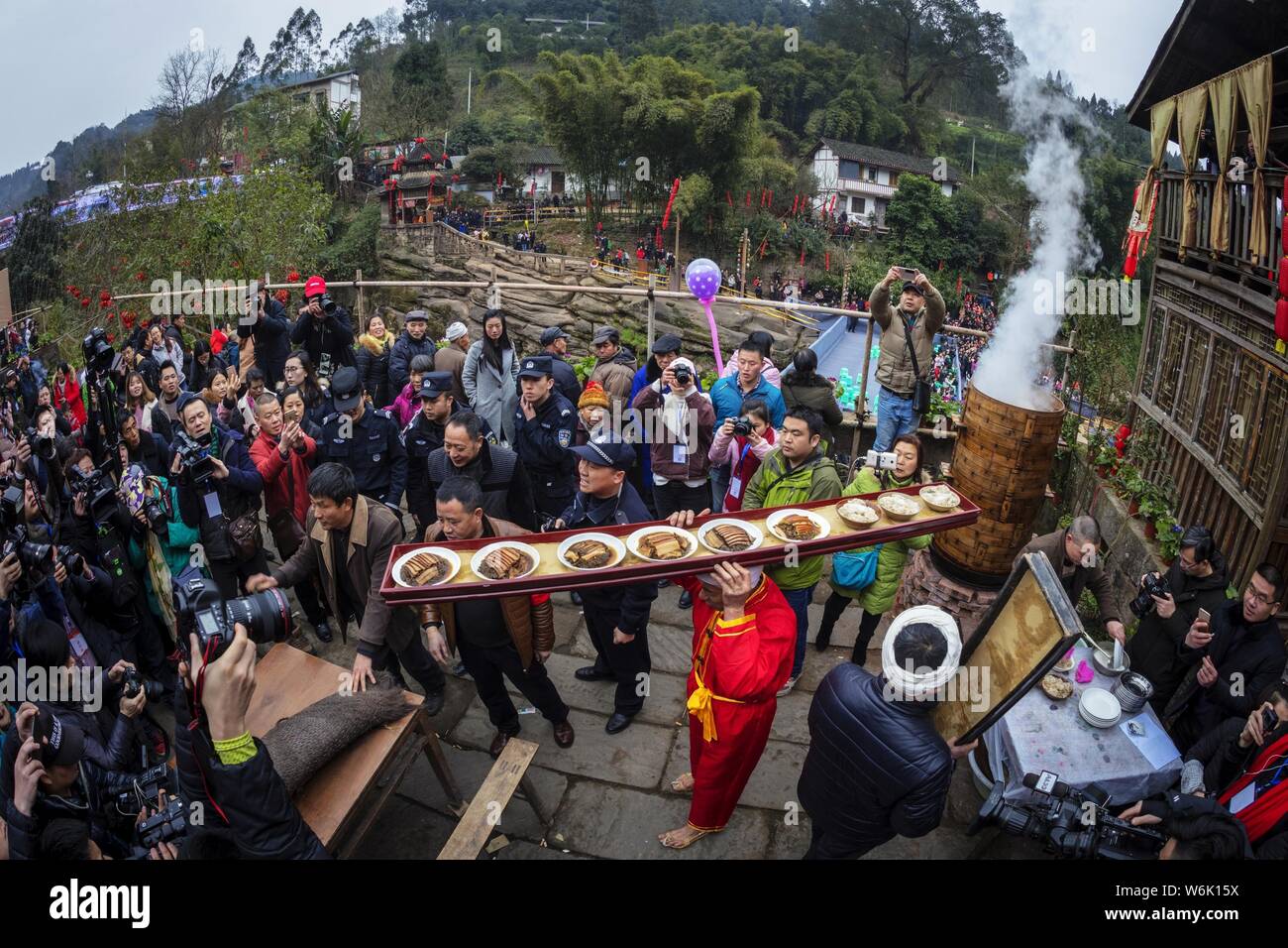 61-year-old Chinese craftsman Yang Guangxiang uses his head to uphold a ...