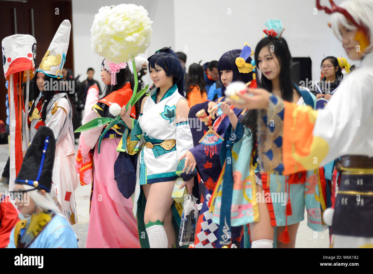 Chinese cosers dressed in cosplay costumes pose during an animation show in Beijing, China, 4 ...