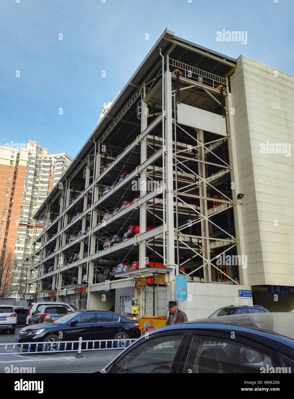 Cars are parked in an automated stacked parking lot in the Peking ...