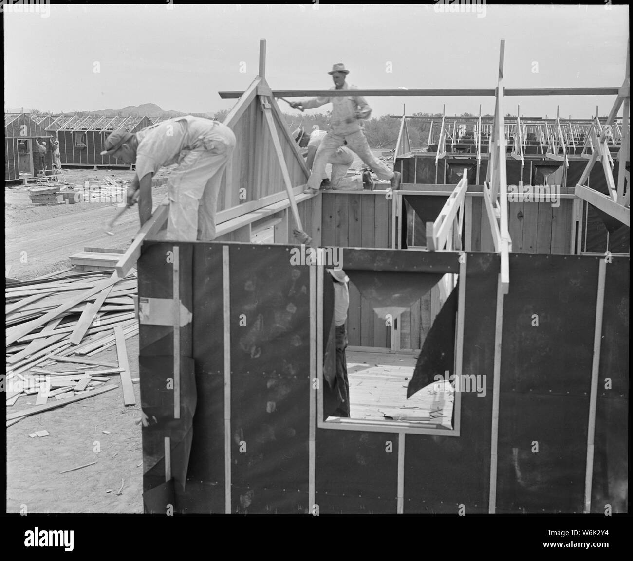 Poston, Arizona. Barracks under construction at this War Relocation ...