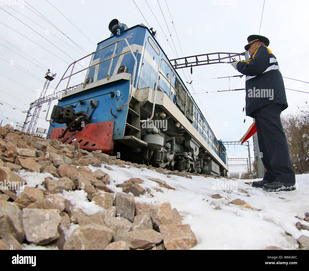 57-year-old Chinese switchman Liu Jun labors at the passenger train ...