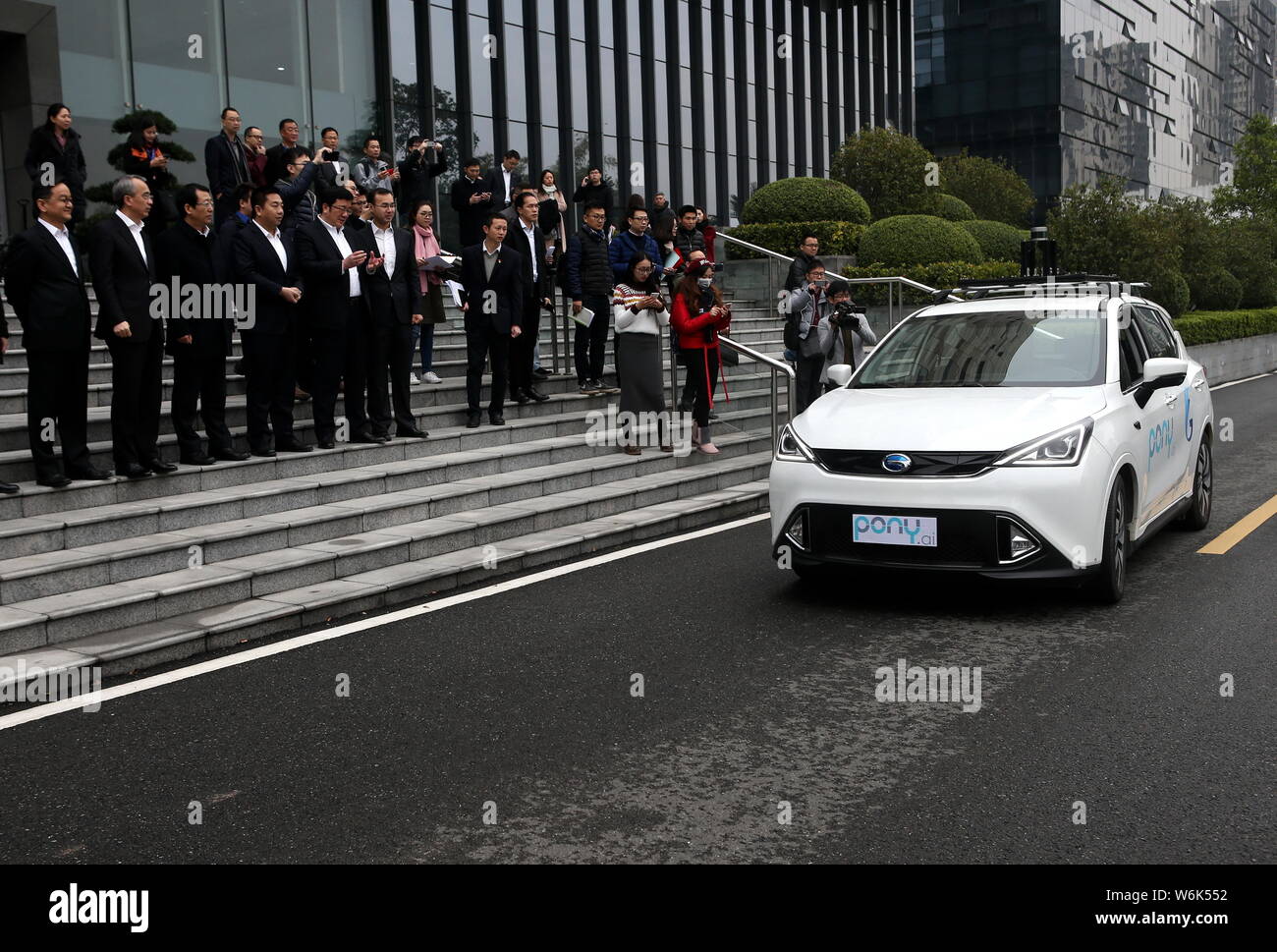 A self-driving car drives during a trial run in Guangzhou city, south ...