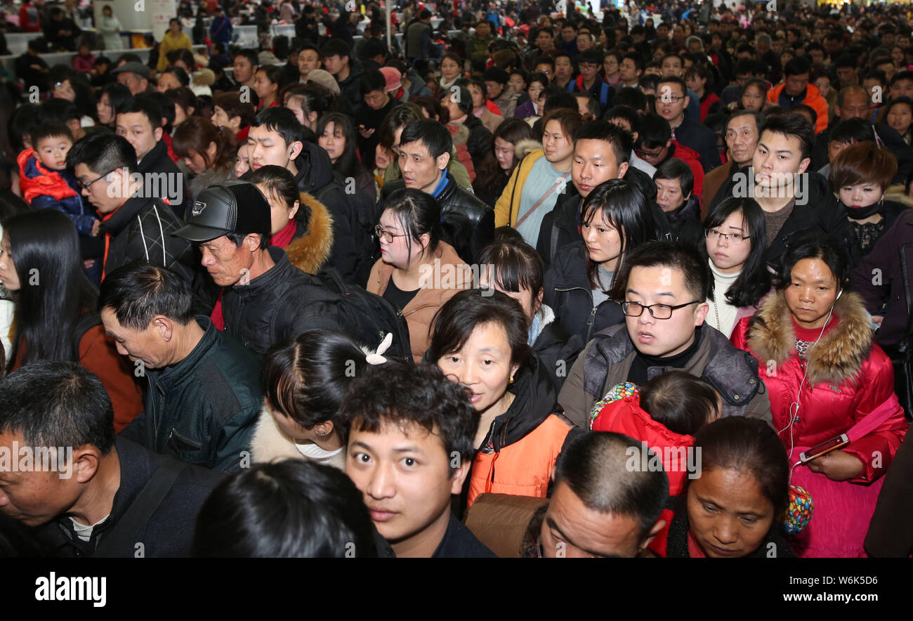 Chinese passengers who are back from the Chinese Lunar New Year holiday ...