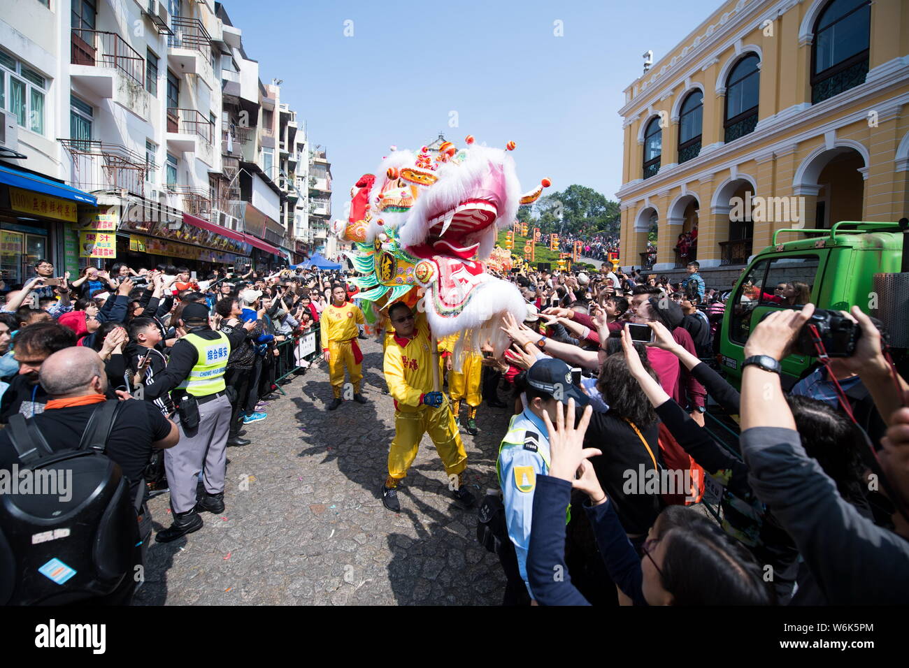 Tourists watch dragon and lion dance performance to celebrate the ...