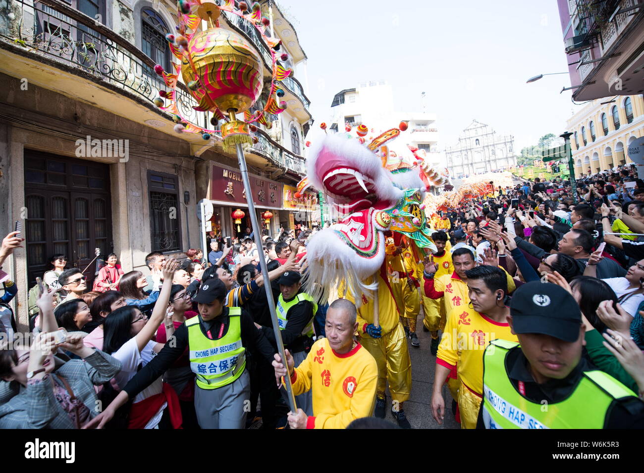 Tourists watch dragon and lion dance performance to celebrate the ...