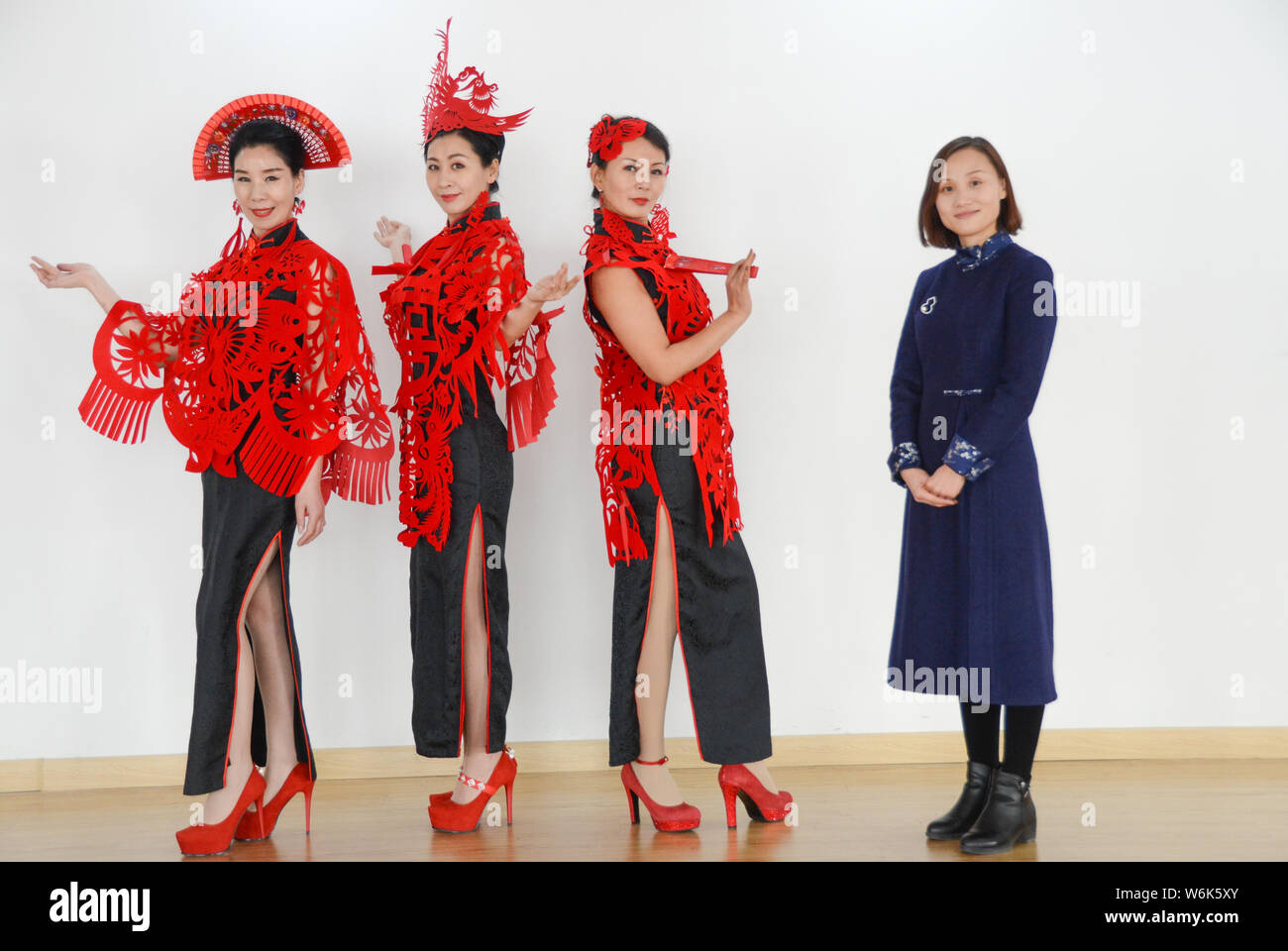 36-year-old Chinese craftsman Liang Ying, right, an inheritor of paper ...