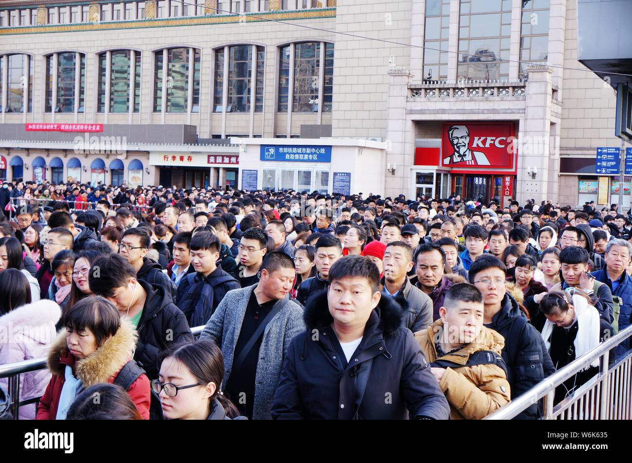 Chinese passengers who are back from the Chinese Lunar New Year holiday ...