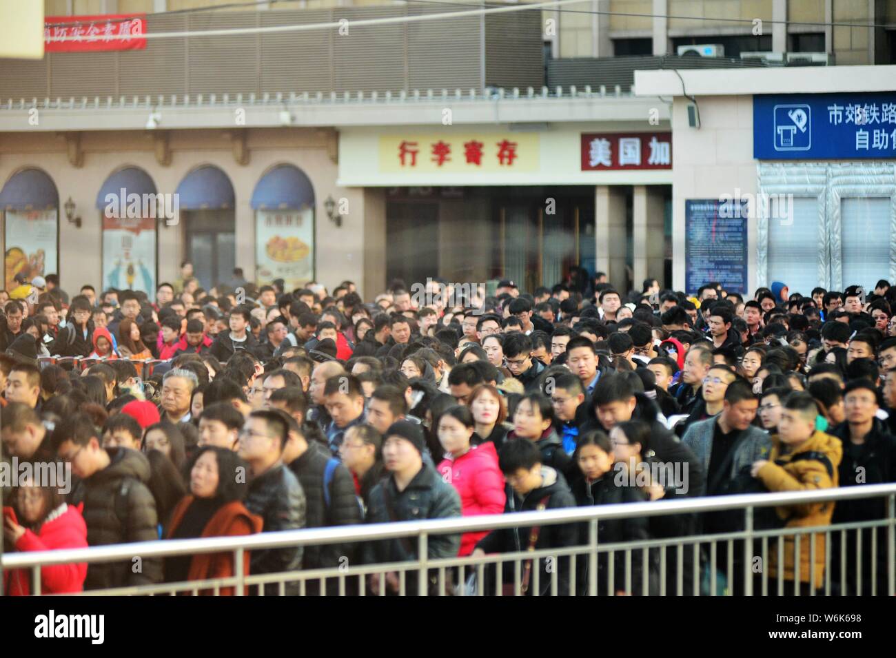 Chinese passengers who are back from the Chinese Lunar New Year holiday ...