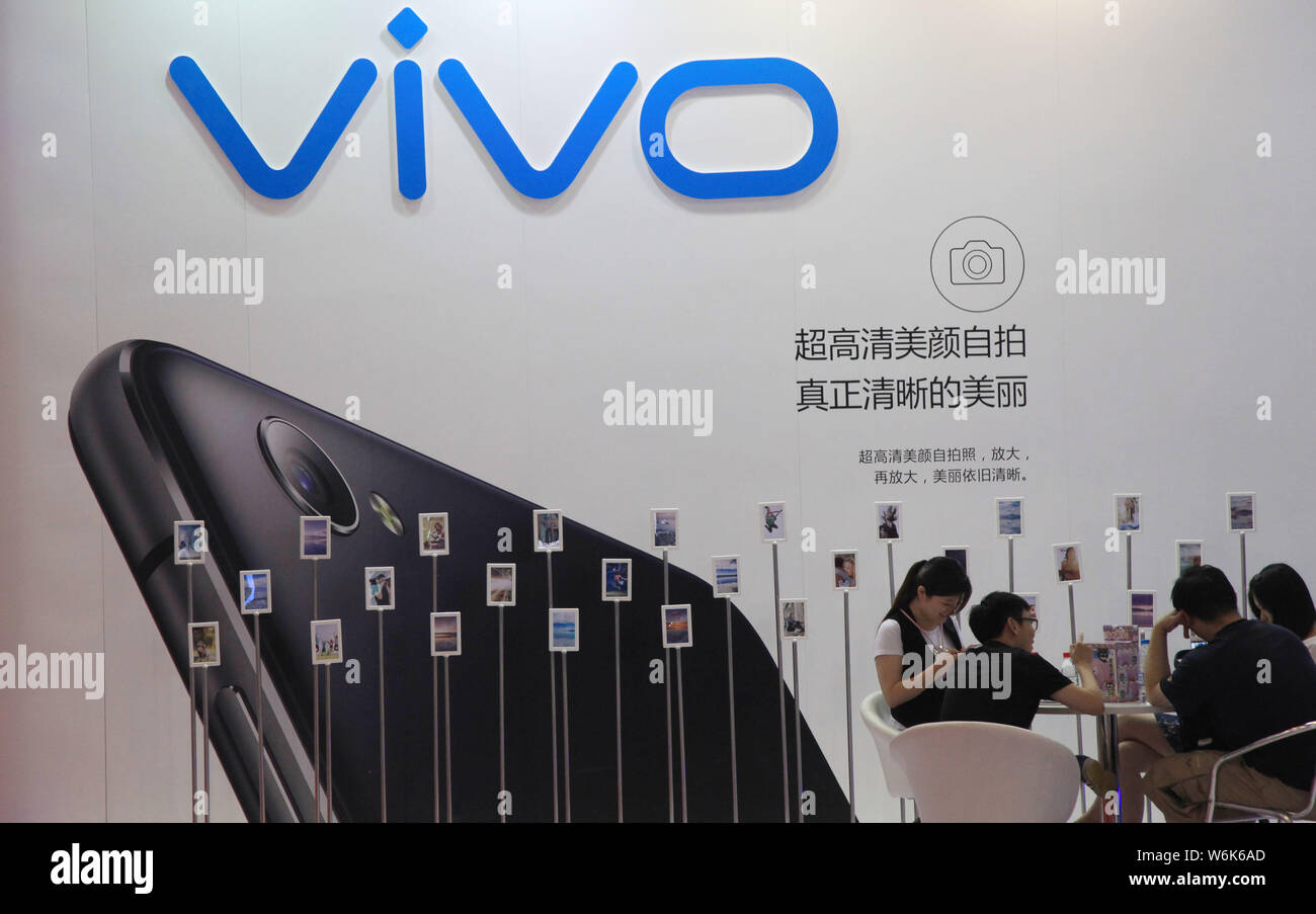 --FILE--People visit the stand of Chinese smartphone maker Vivo during ...