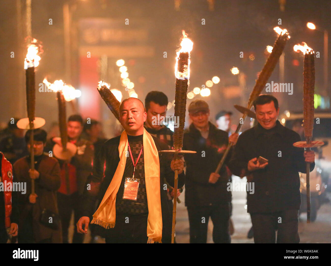 Local villagers take part in a parade for the Torch Festival or Fire ...