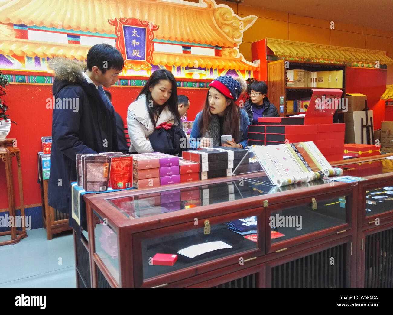 Customers shop for souvenirs at a flashmob store of Palace Museum, also ...