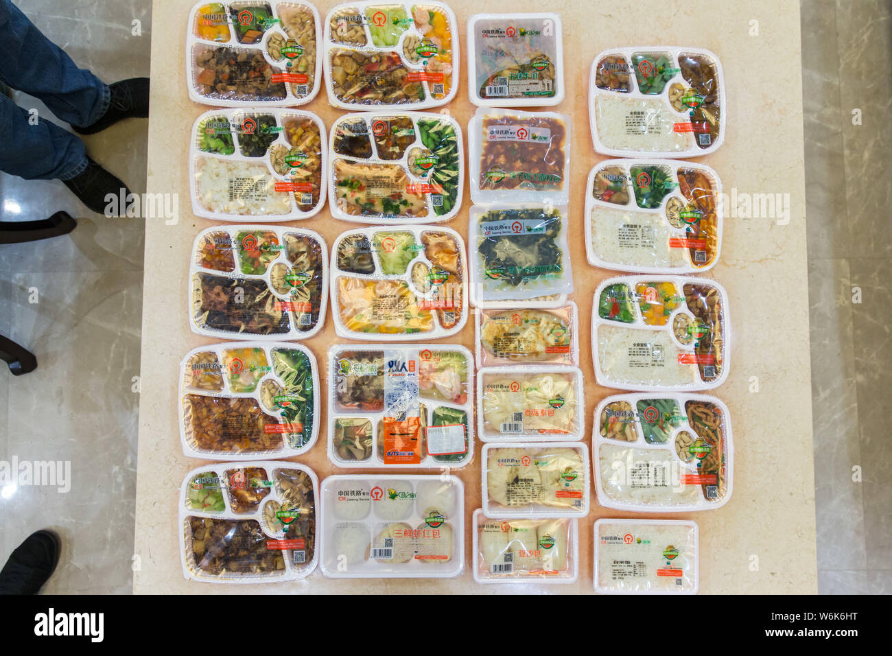 Food-filled lunch boxes are on display at a food processing plant of ...