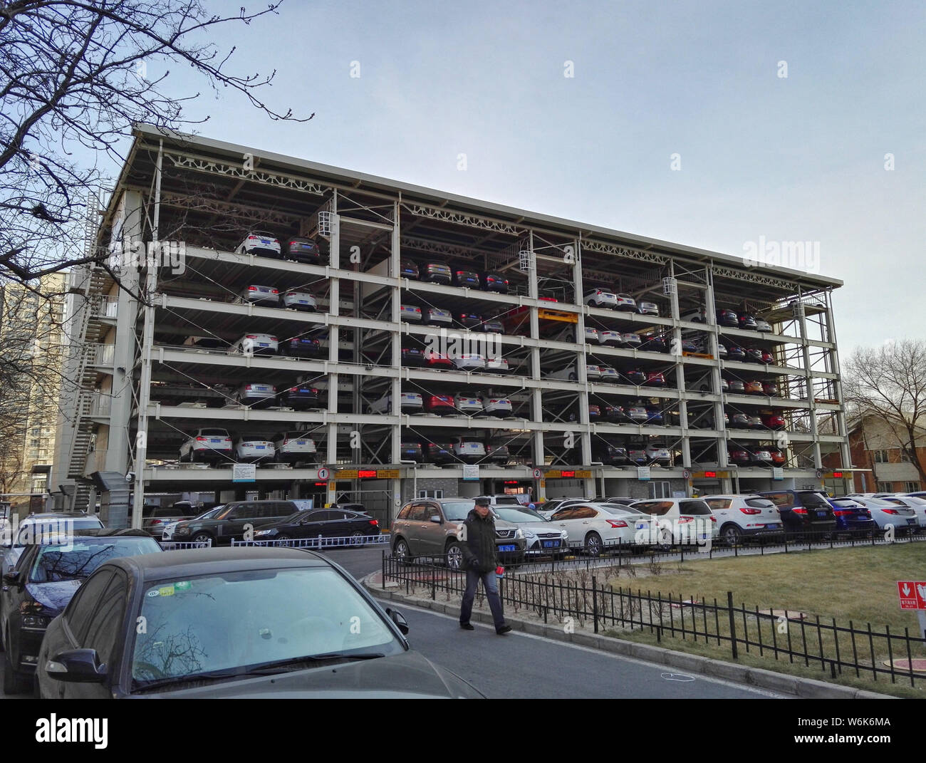 Cars are parked in an automated stacked parking lot in the Peking ...