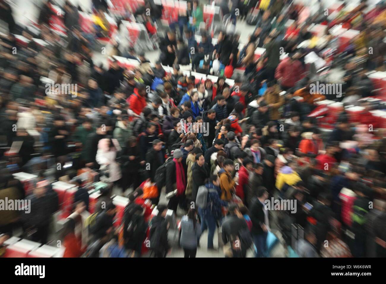 Chinese passengers who are back from the Chinese Lunar New Year holiday ...