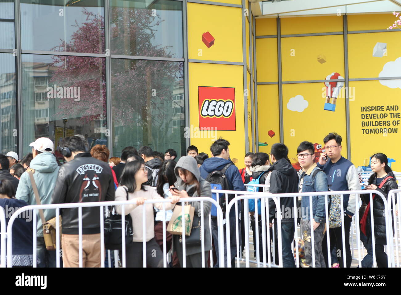 --FILE--Customers queue up in front of a Lego store in Shanghai, China ...