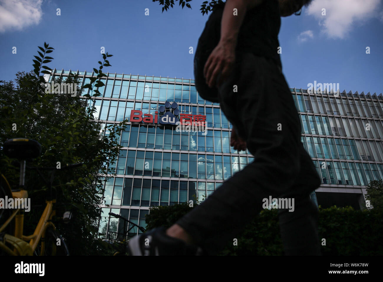 --FILE--A pedestrian walks past the headquarters of Chinese internet ...