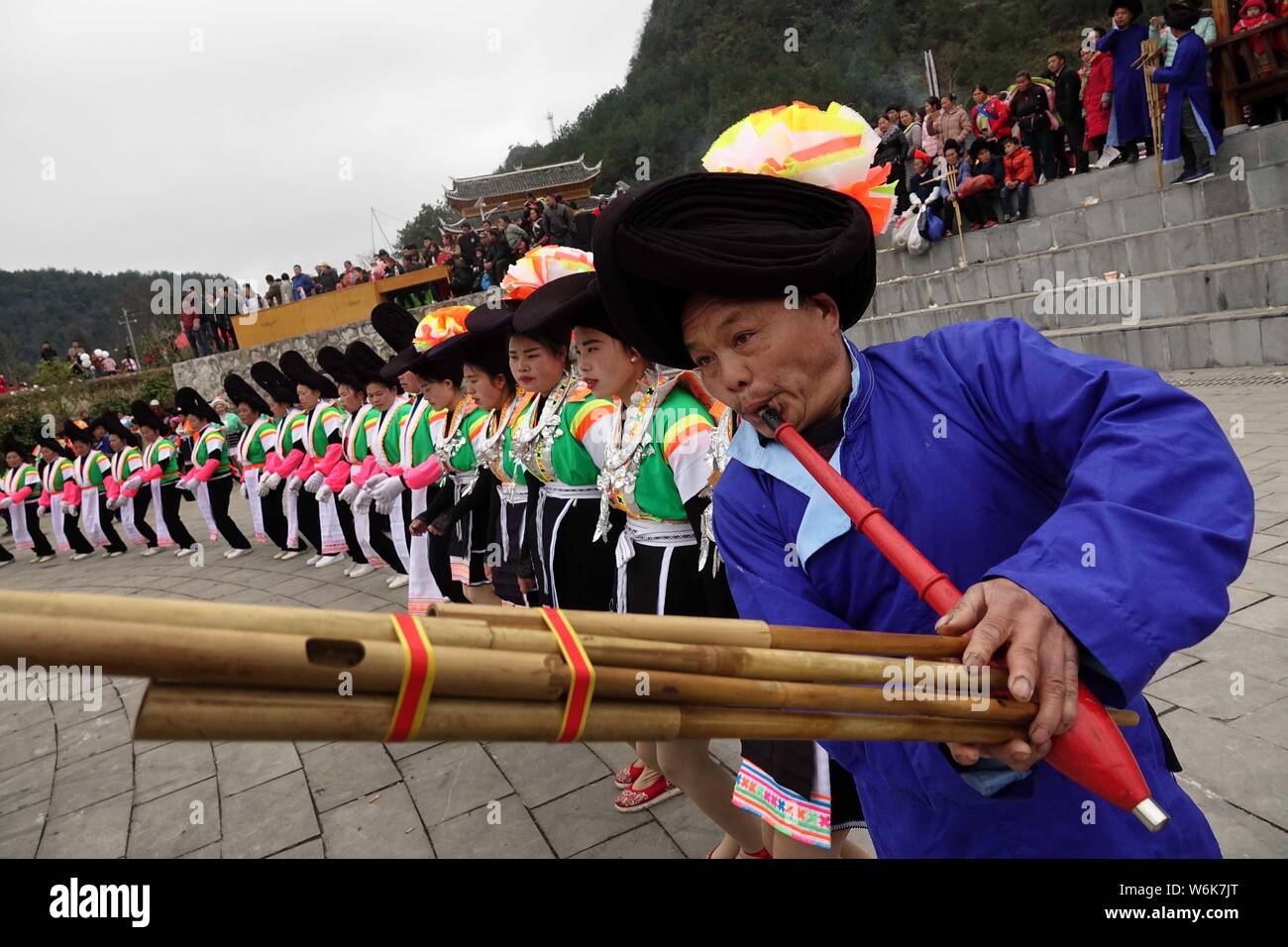 Chinese people of Miao ethnic minority gather in a circle to dance and ...