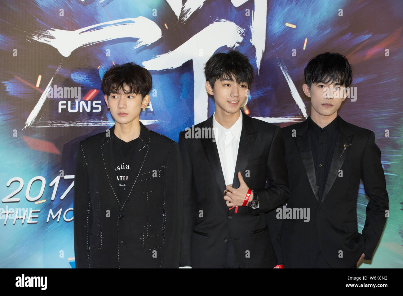 (From left) Roy Wang or Wang Yuan, Karry Wang or Wang Junkai, and ...