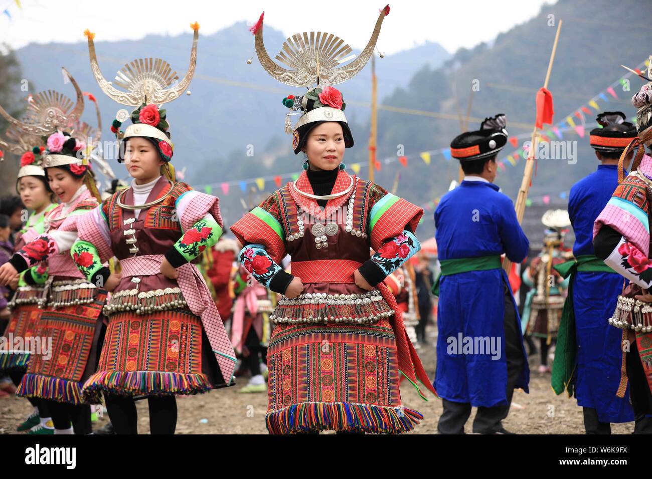Chinese girls of Miao ethnic minority dressed in traditional silver ...