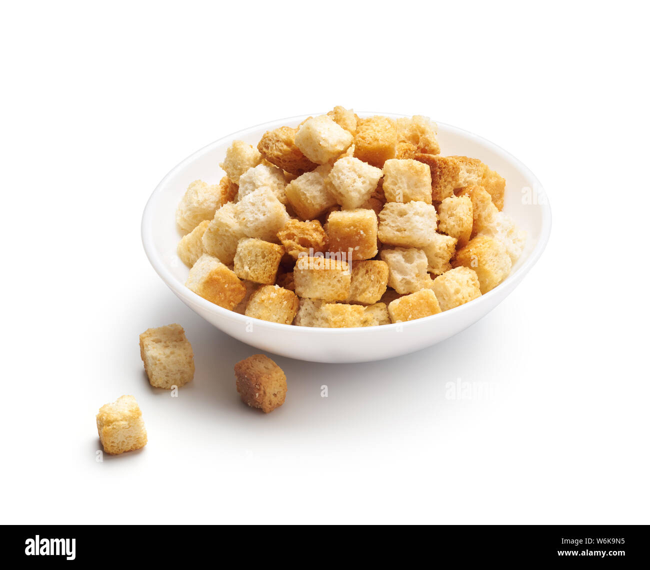 Crispy croutons in bowl isolated on white background Stock Photo - Alamy