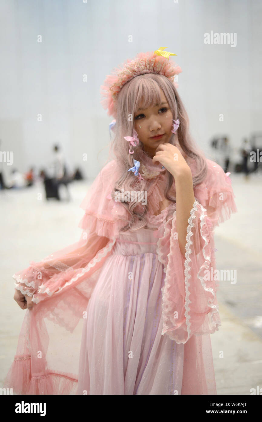 A Chinese coser dressed in cosplay costume poses during an animation ...