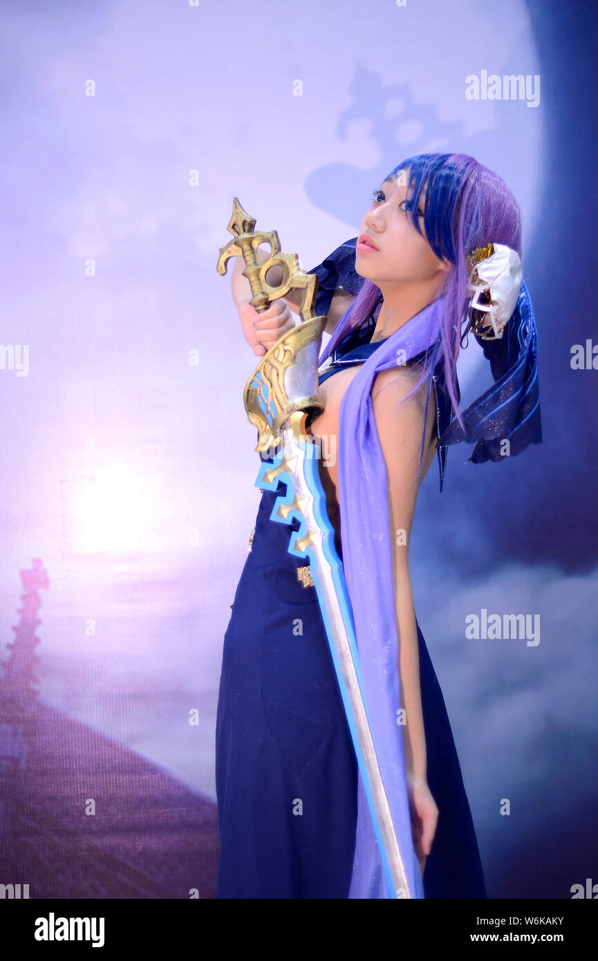 A Chinese coser dressed in cosplay costume poses during an animation ...