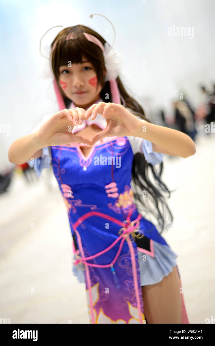 A Chinese coser dressed in cosplay costume poses during an animation ...