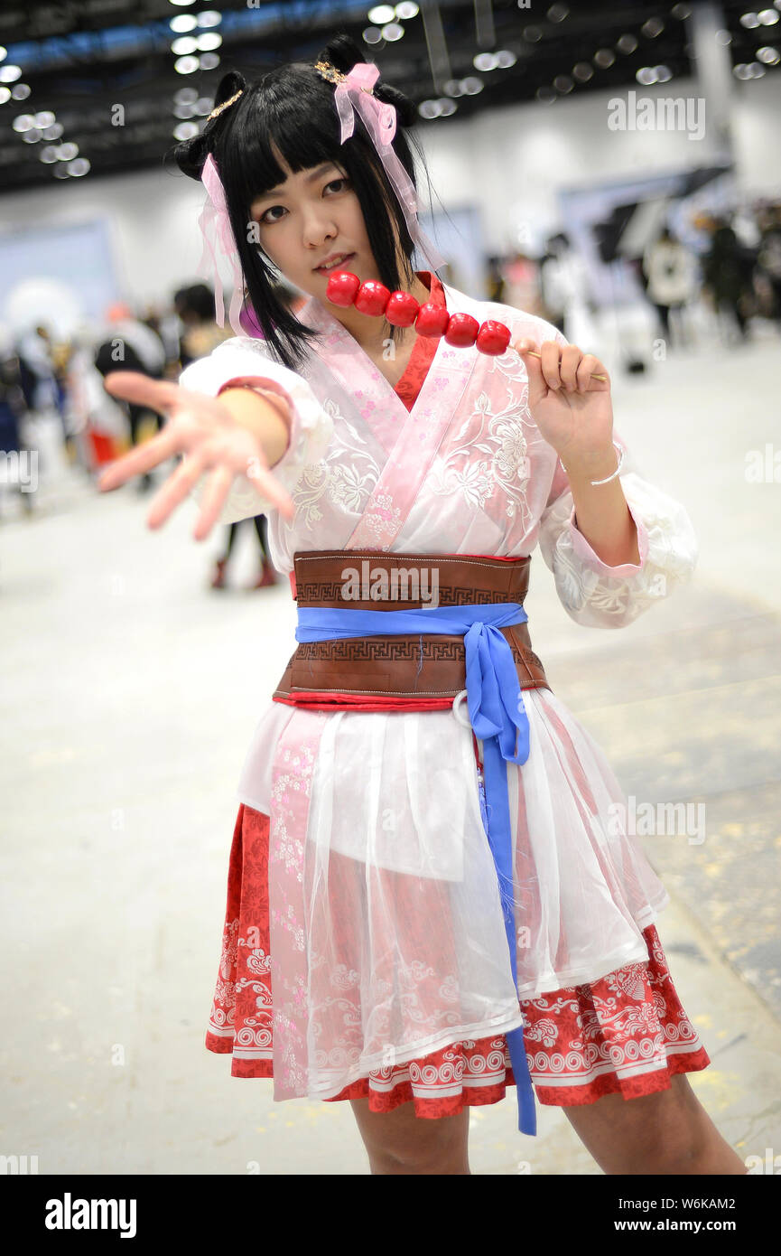 A Chinese coser dressed in cosplay costume poses during an animation ...