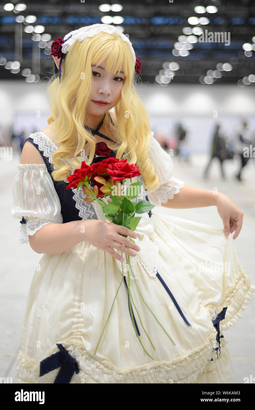A Chinese coser dressed in cosplay costume poses during an animation ...