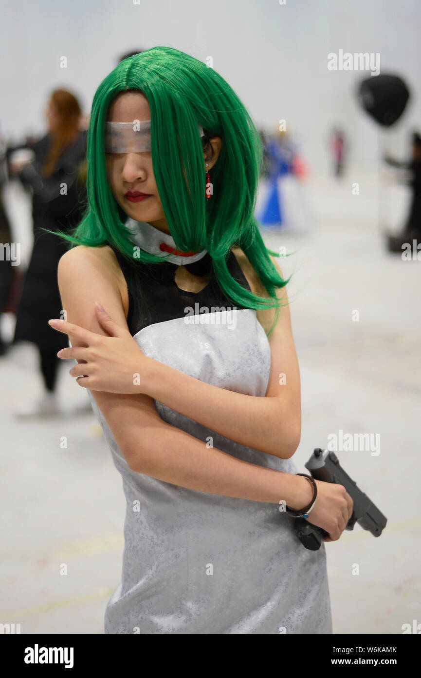 A Chinese coser dressed in cosplay costume poses during an animation ...