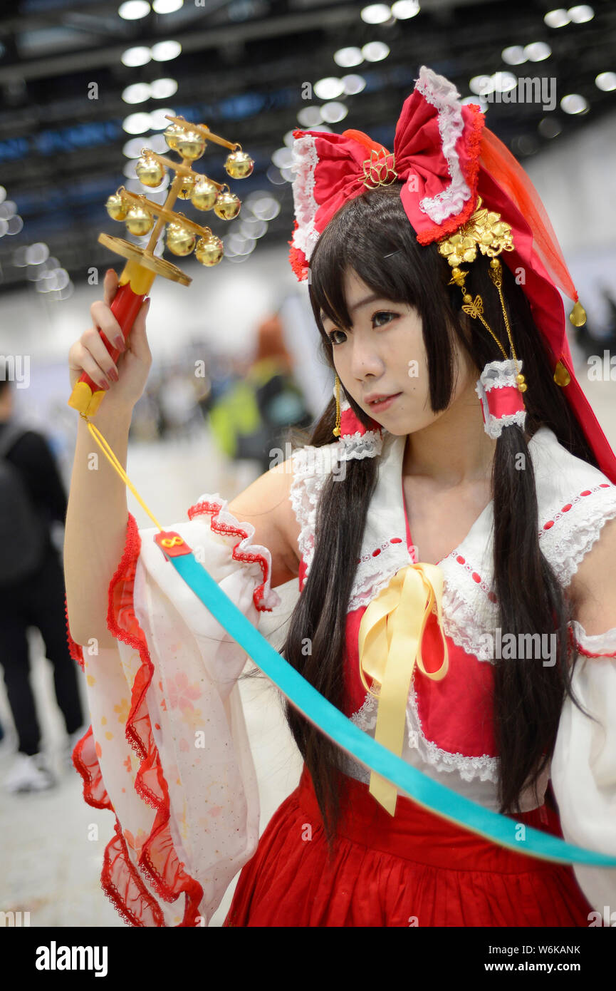 A Chinese coser dressed in cosplay costume poses during an animation ...