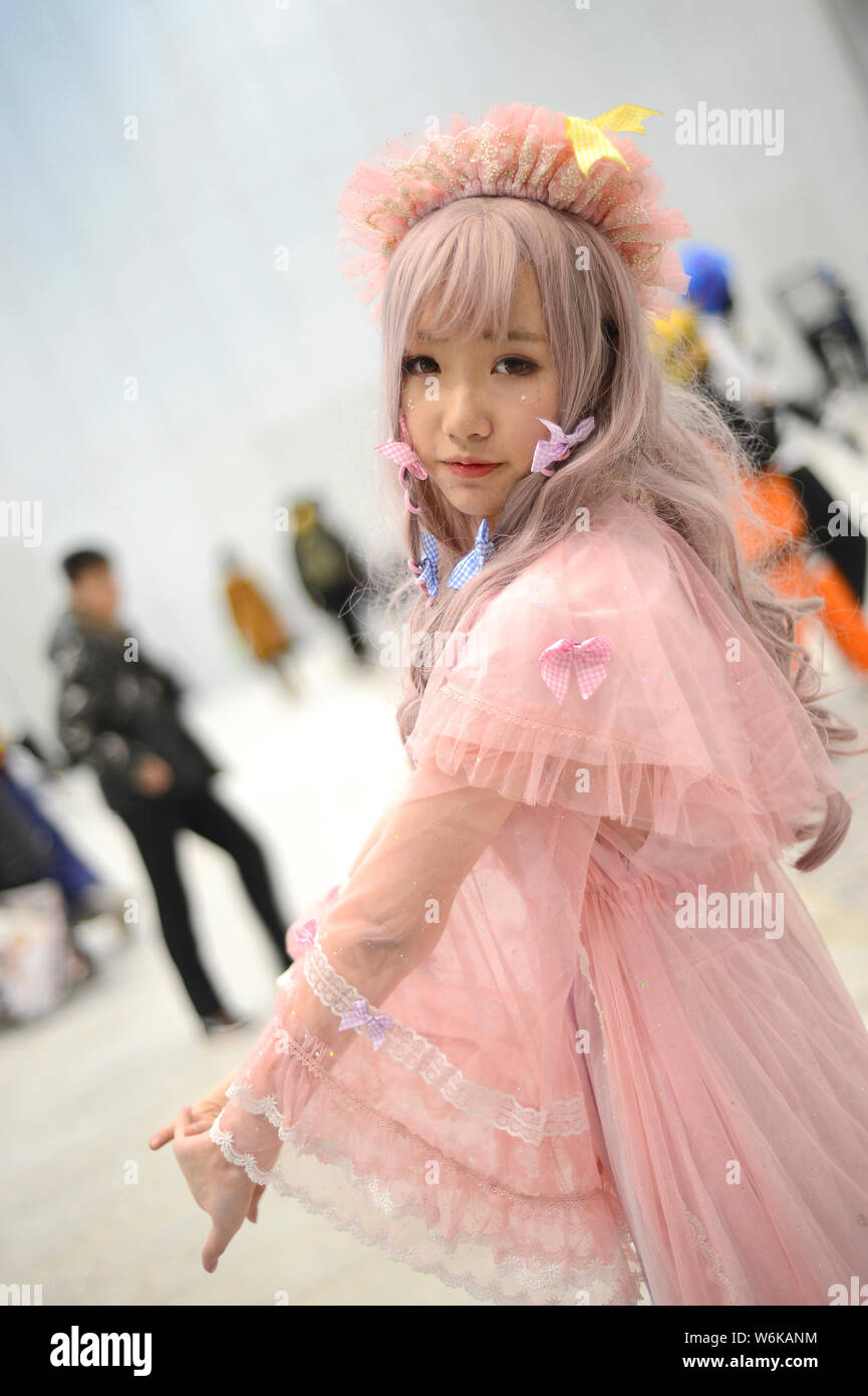 A Chinese coser dressed in cosplay costume poses during an animation ...