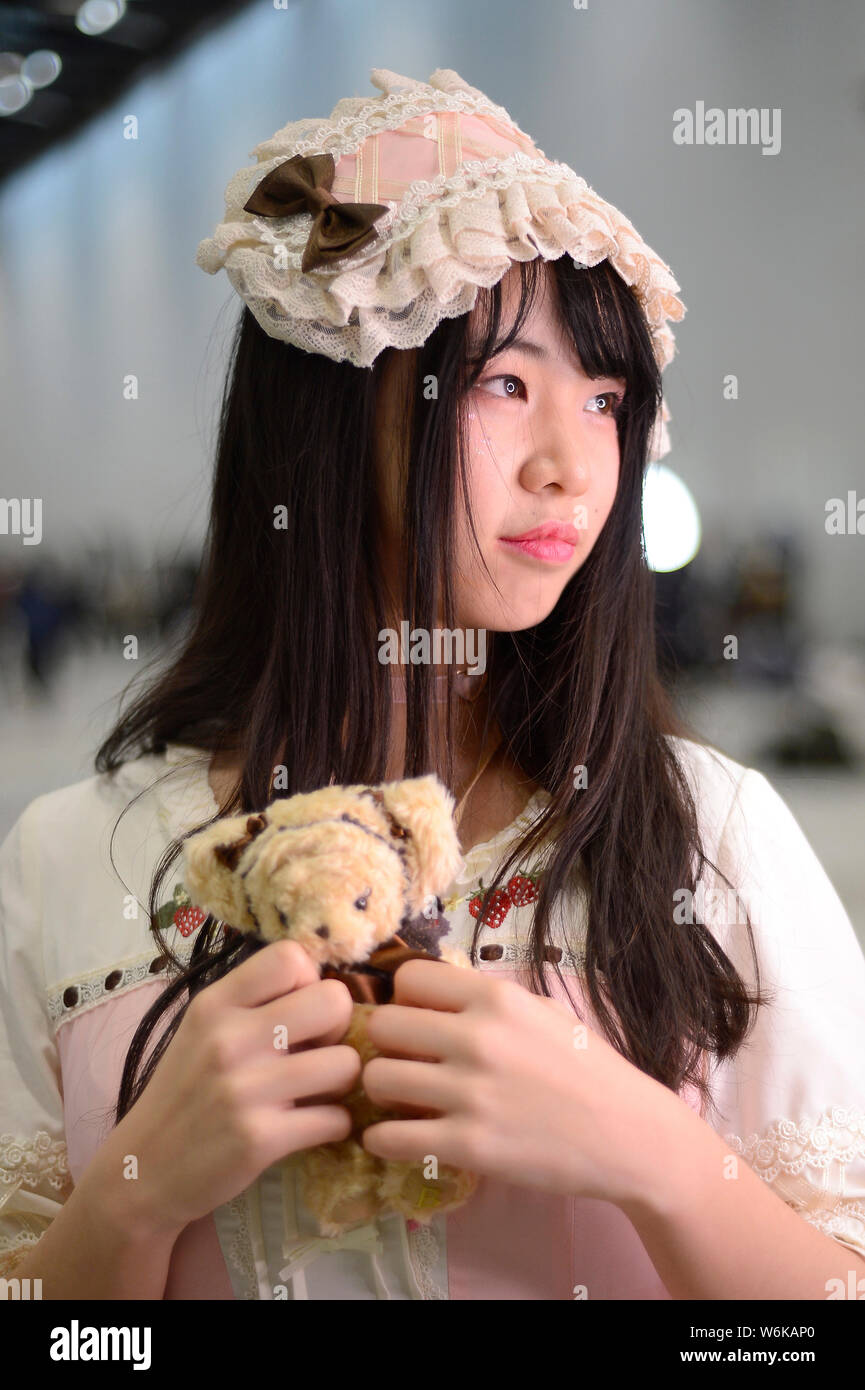 A Chinese coser dressed in cosplay costume poses during an animation ...
