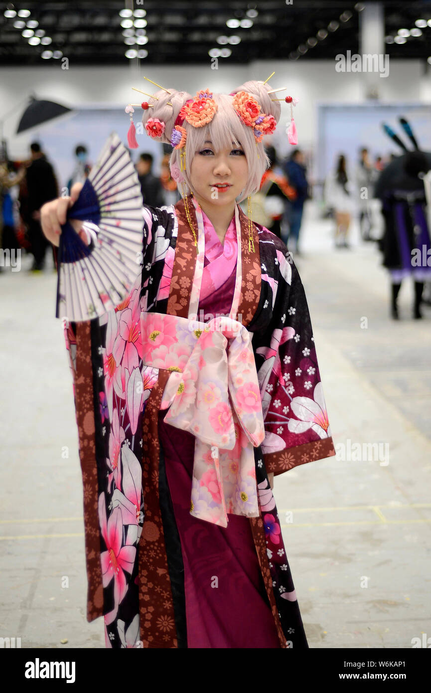 A Chinese coser dressed in cosplay costume poses during an animation ...