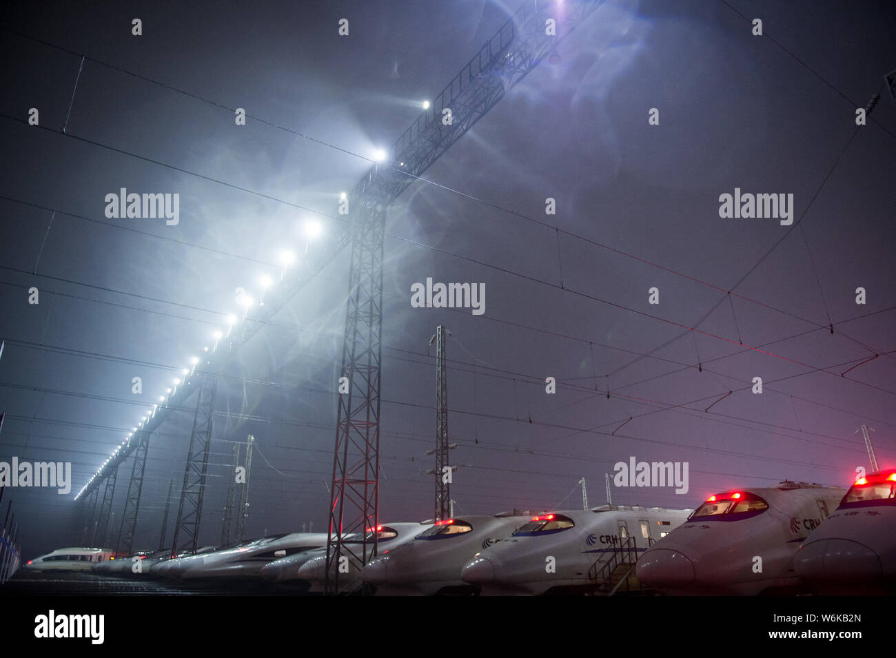 CRH (China Railway High-speed) bullet trains are standby for the Spring ...