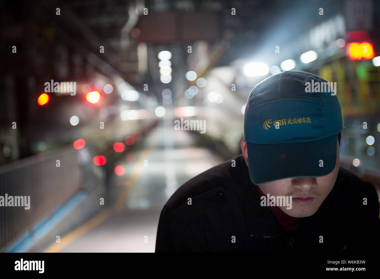 A Chinese worker checks a CRH (China Railway High-speed) bullet train ... A Chinese worker checks a CRH (China Railway High-speed) bullet train ...