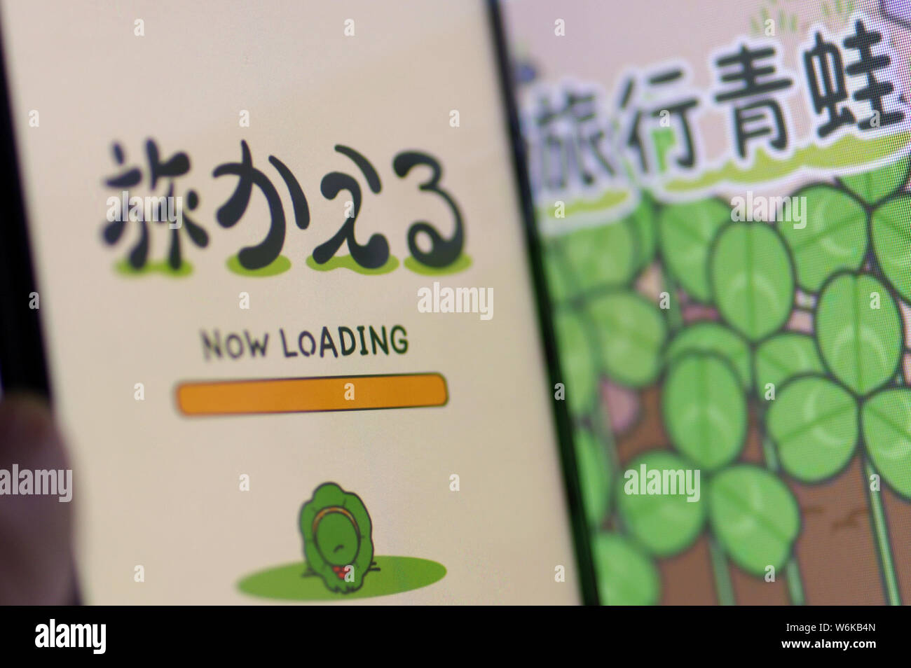 A Chinese player plays mobile game "Tabi Kaeru," or "Traveling Frog ...