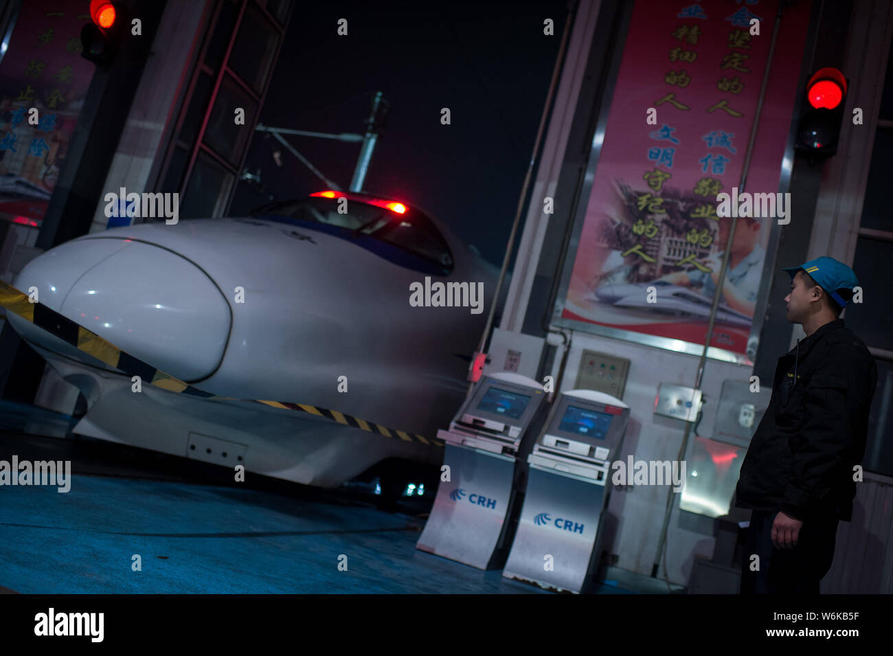 A Chinese worker checks a CRH (China Railway High-speed) bullet train for the Spring Festival ...