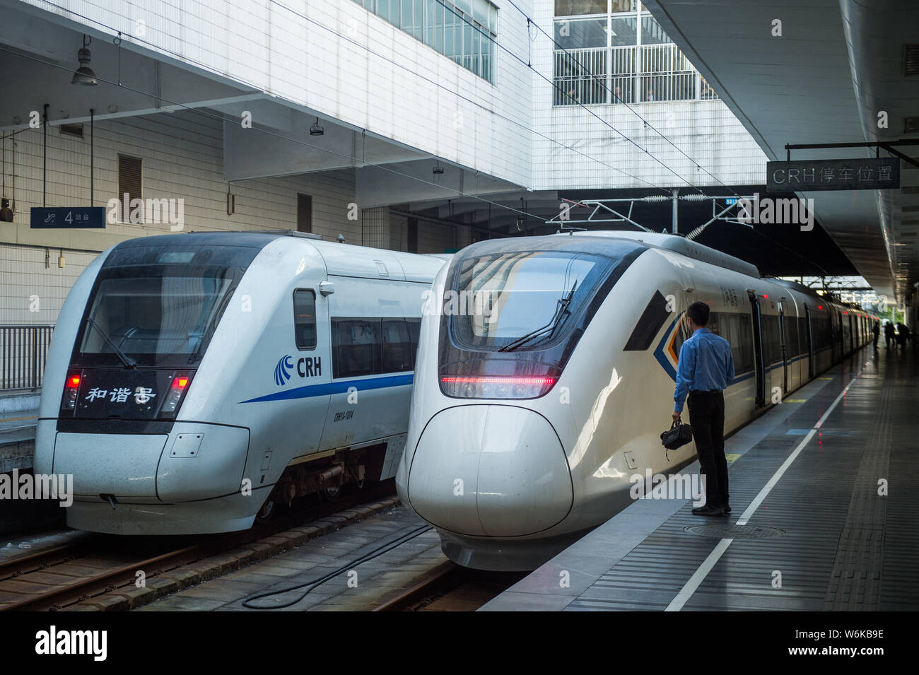 CRH6-type, right, and CRH1-type intercity trains of China High-speed Railway on the Guangzhou ...