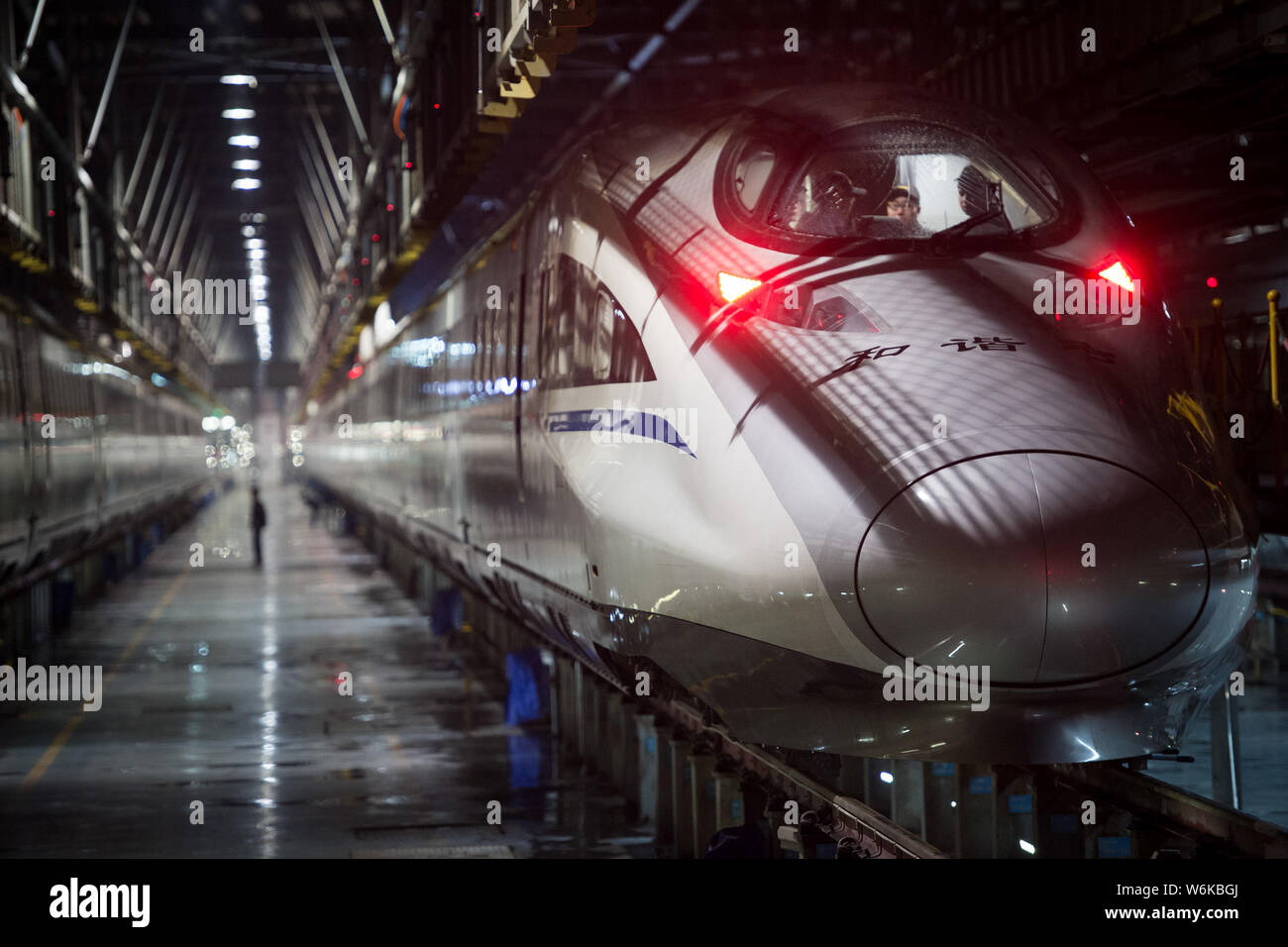 CRH (China Railway High-speed) bullet trains are standby for the Spring ...